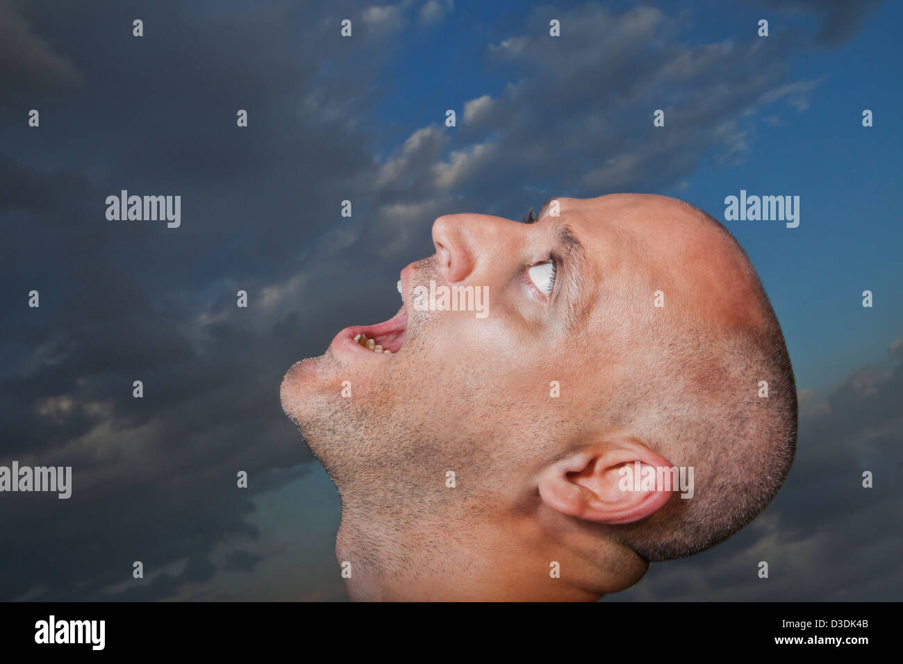 Man looking towards sky and shouting Stock Photo - Alamy