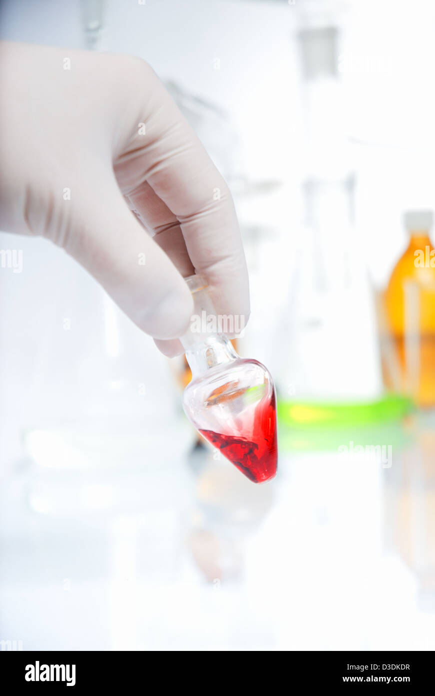 Doctor's hand in glove with blood in laboratory Stock Photo - Alamy