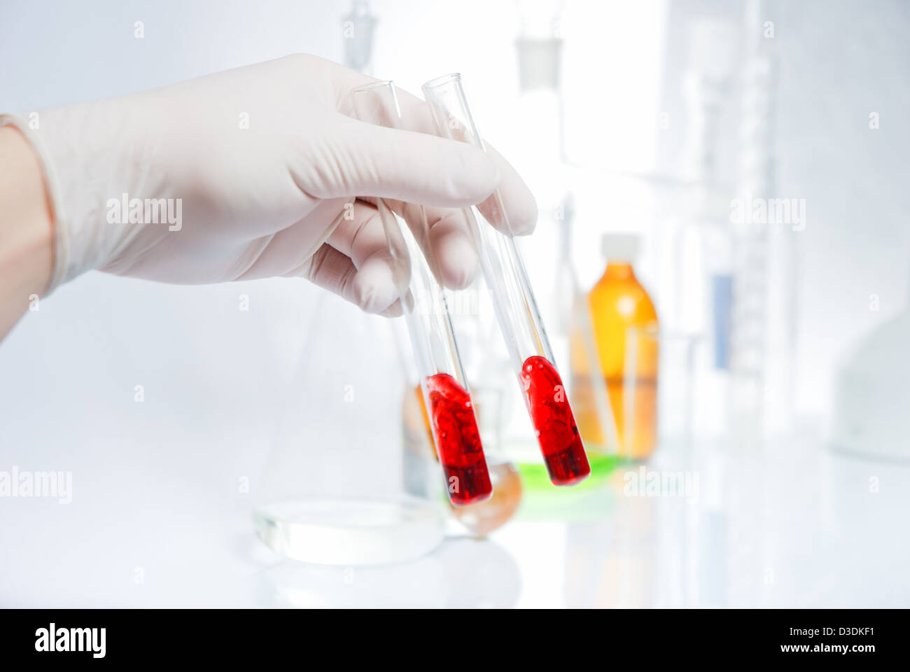 Doctor's hand in glove with blood in laboratory Stock Photo - Alamy