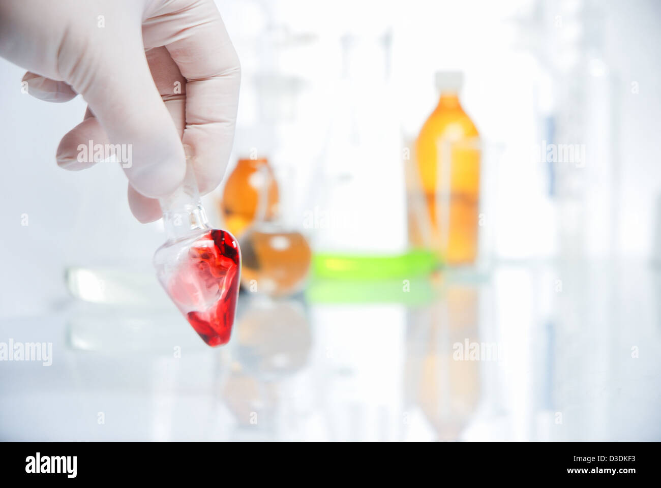 Doctor's hand in glove with blood in laboratory Stock Photo - Alamy