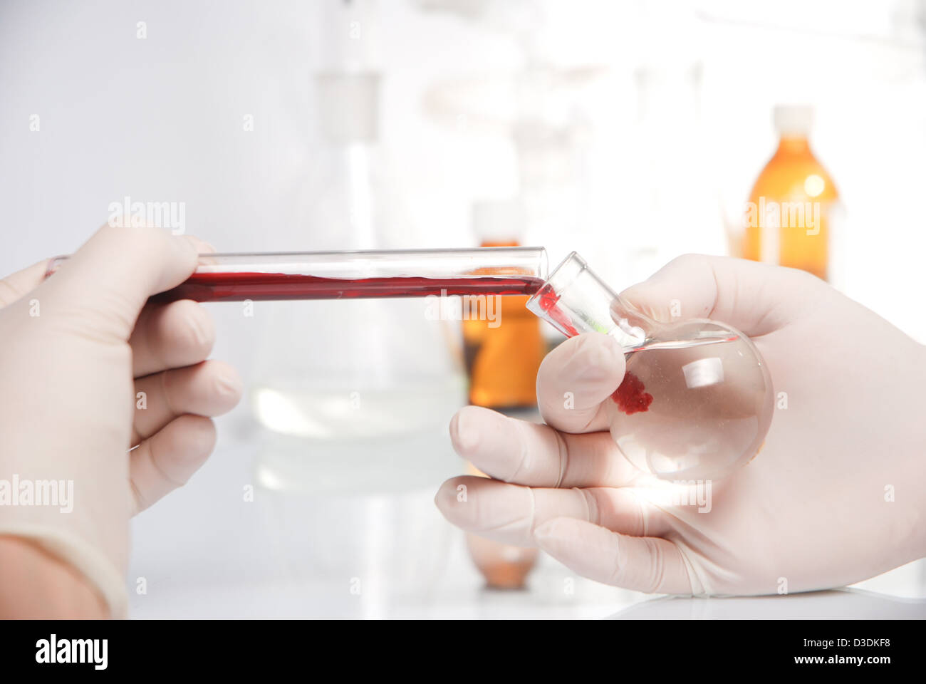 Doctor's hand in glove with blood in laboratory Stock Photo - Alamy
