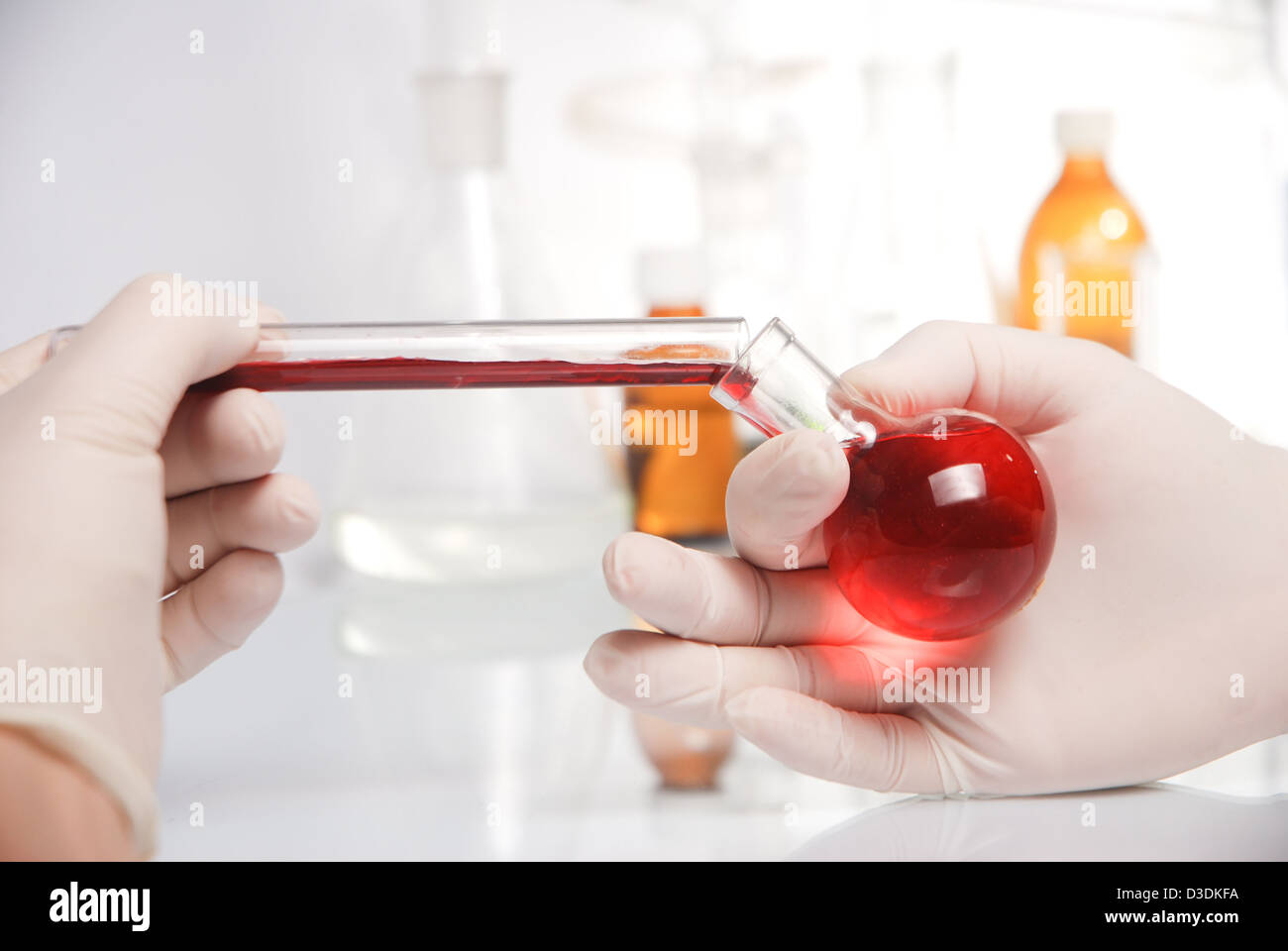 Doctor's hand in glove with blood in laboratory Stock Photo - Alamy