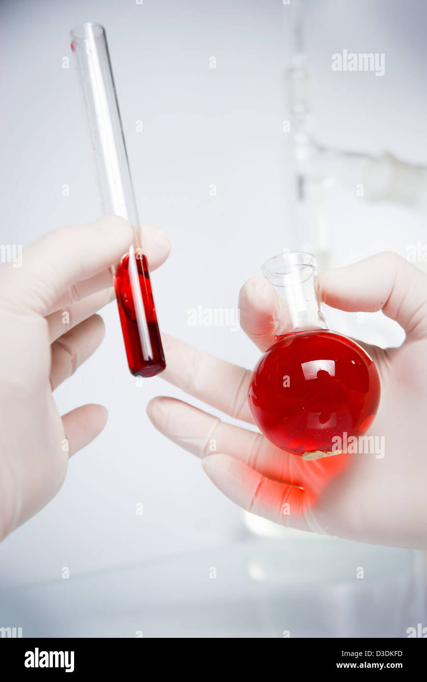 Doctor's hand in glove with blood in laboratory Stock Photo - Alamy