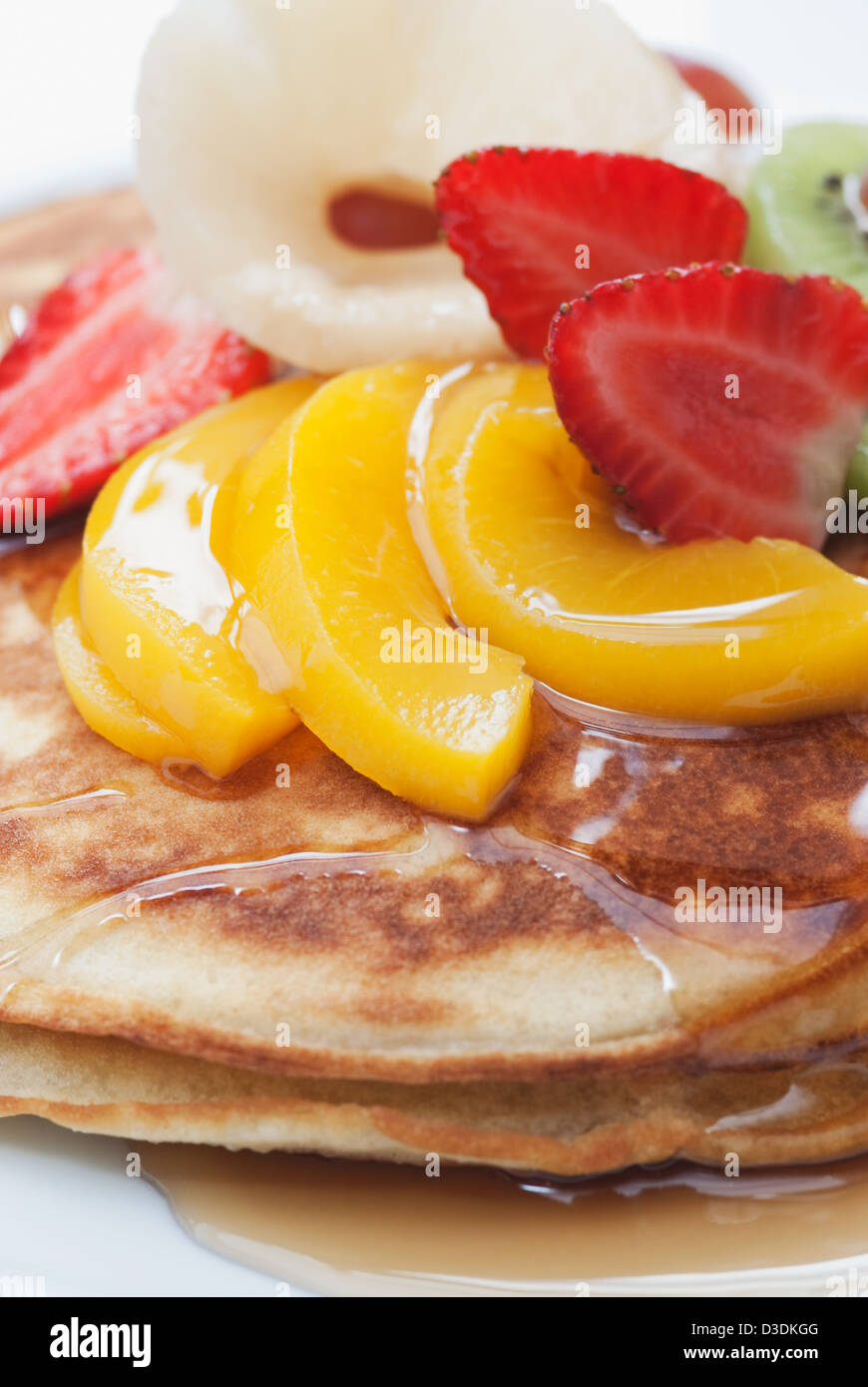 Breakfast pancakes with fruit topping and syrup Stock Photo - Alamy
