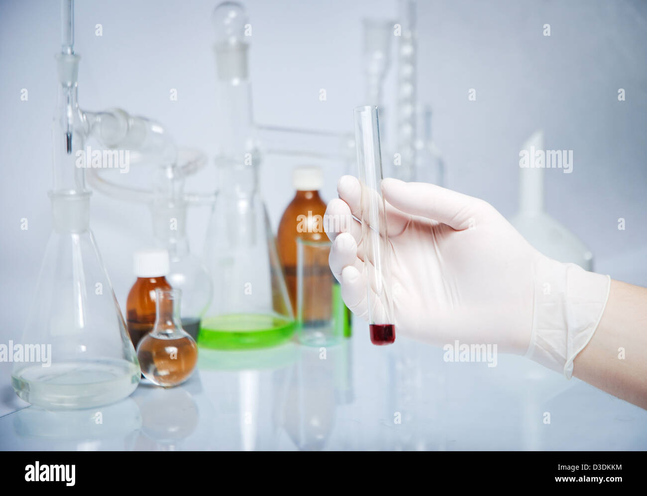 Doctor's hand in glove with blood in laboratory Stock Photo - Alamy