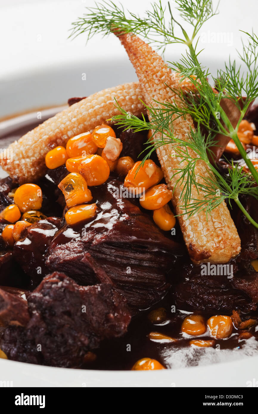Peruvian food beef in sauce with corn Stock Photo - Alamy