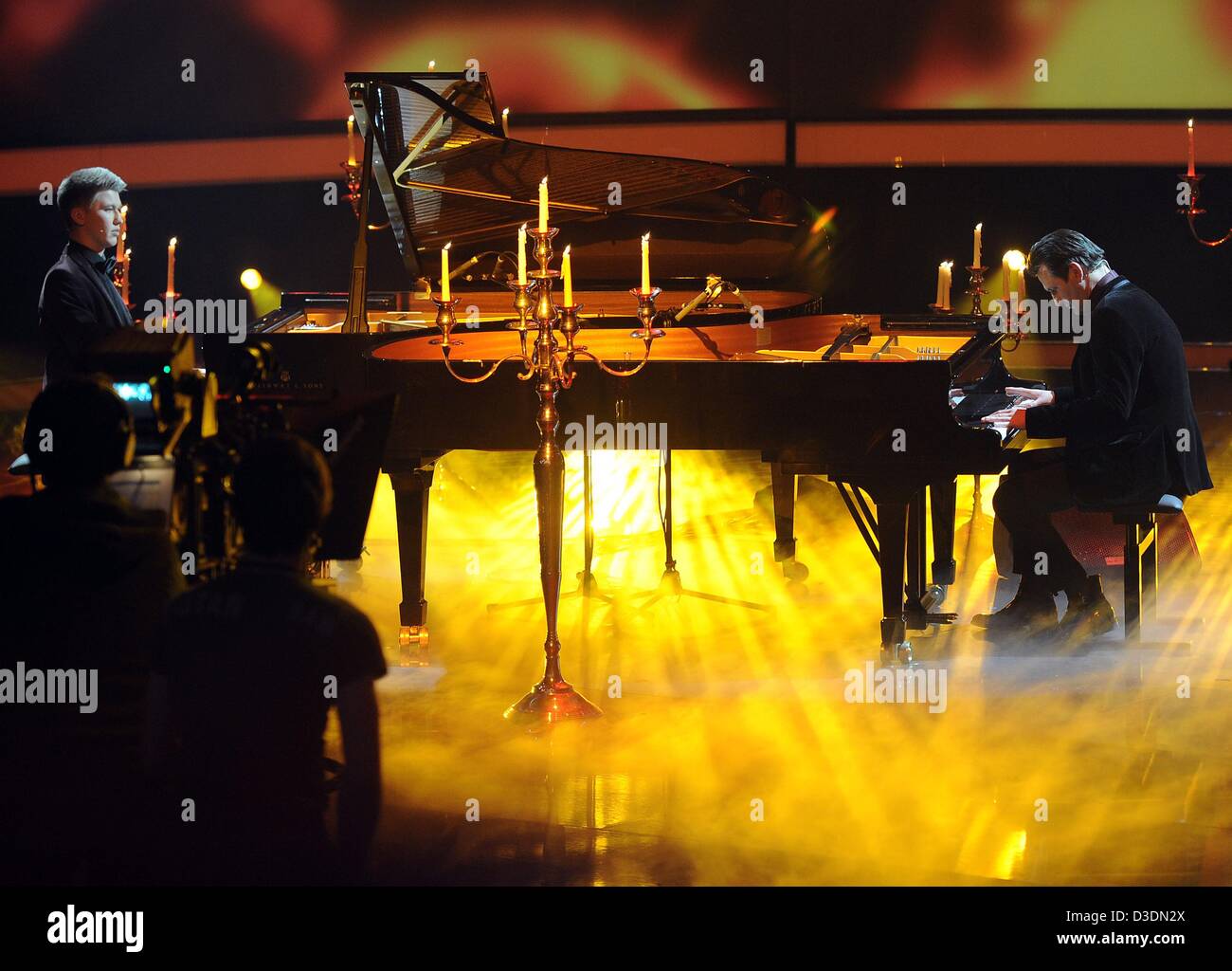 Pianist Alexander Vorontsov (L) and actor Ingo Naujoks (R) perform ...