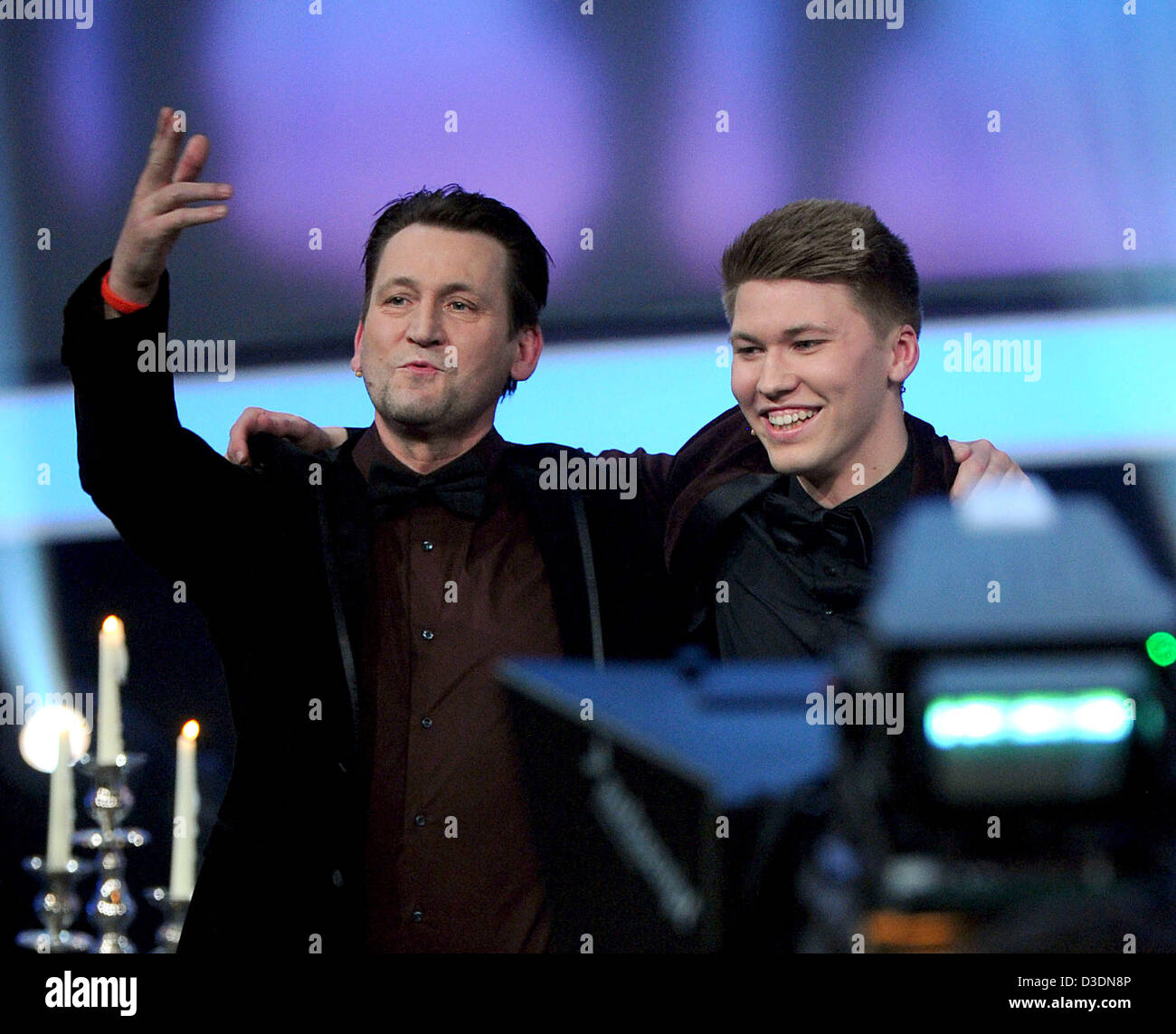 Pianist Alexander Vorontsov (L) and actor Ingo Naujoks (R) stand during ...