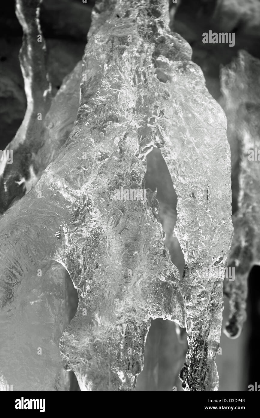 Ice formed from flowing waterslowly begins to melt Stock Photo - Alamy