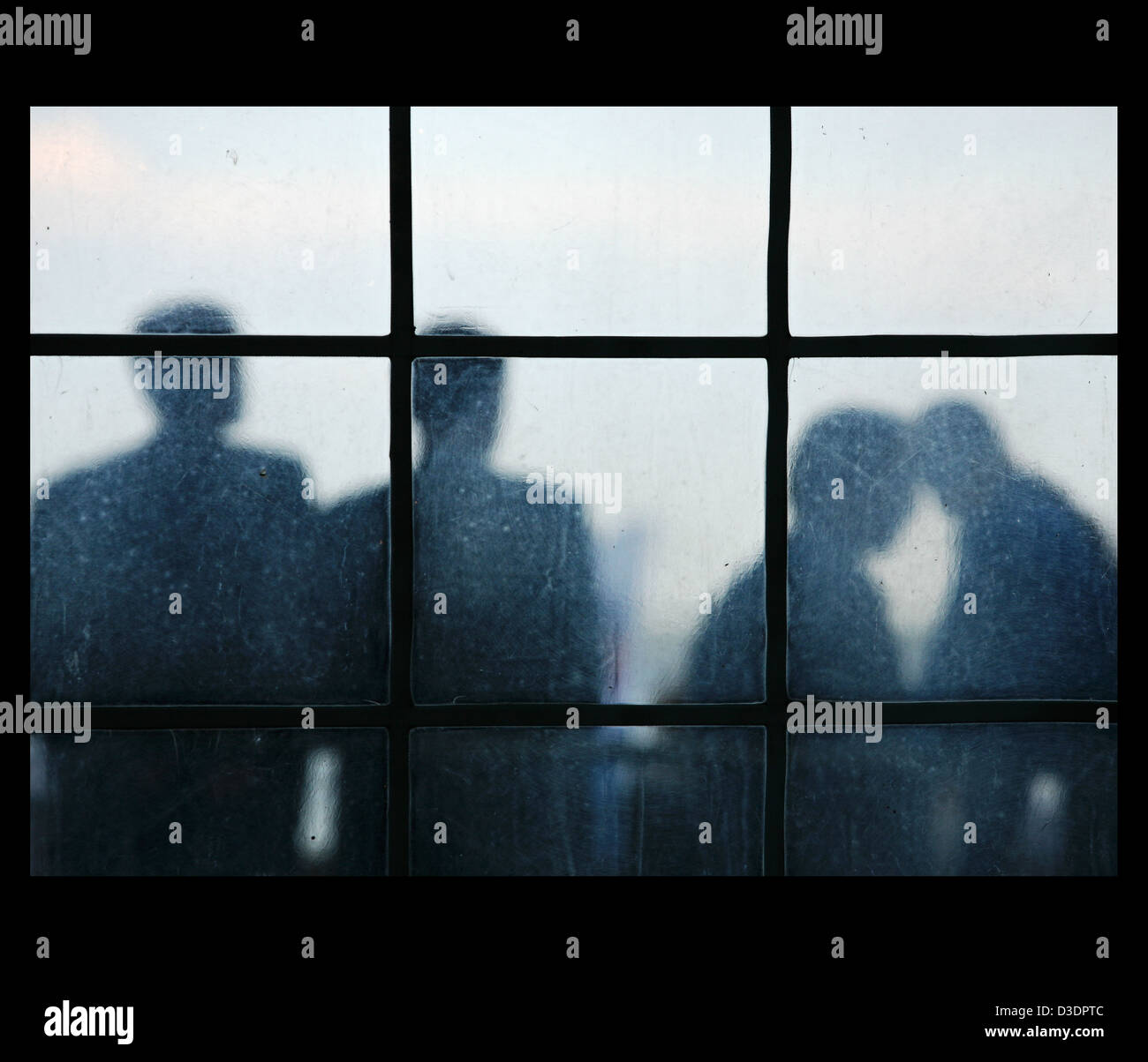 Four silhouettes of people behind of a window Stock Photo - Alamy