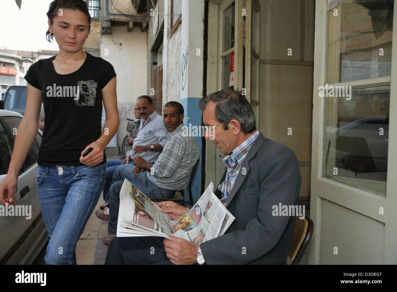 Nicosia, Turk Republic of Northern Cyprus, man reading newspaper in a ...