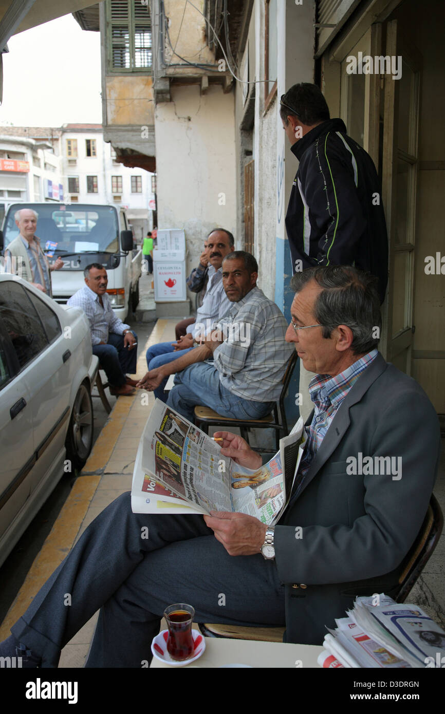 Nicosia, Turk Republic of Northern Cyprus, man reading newspaper in a ...