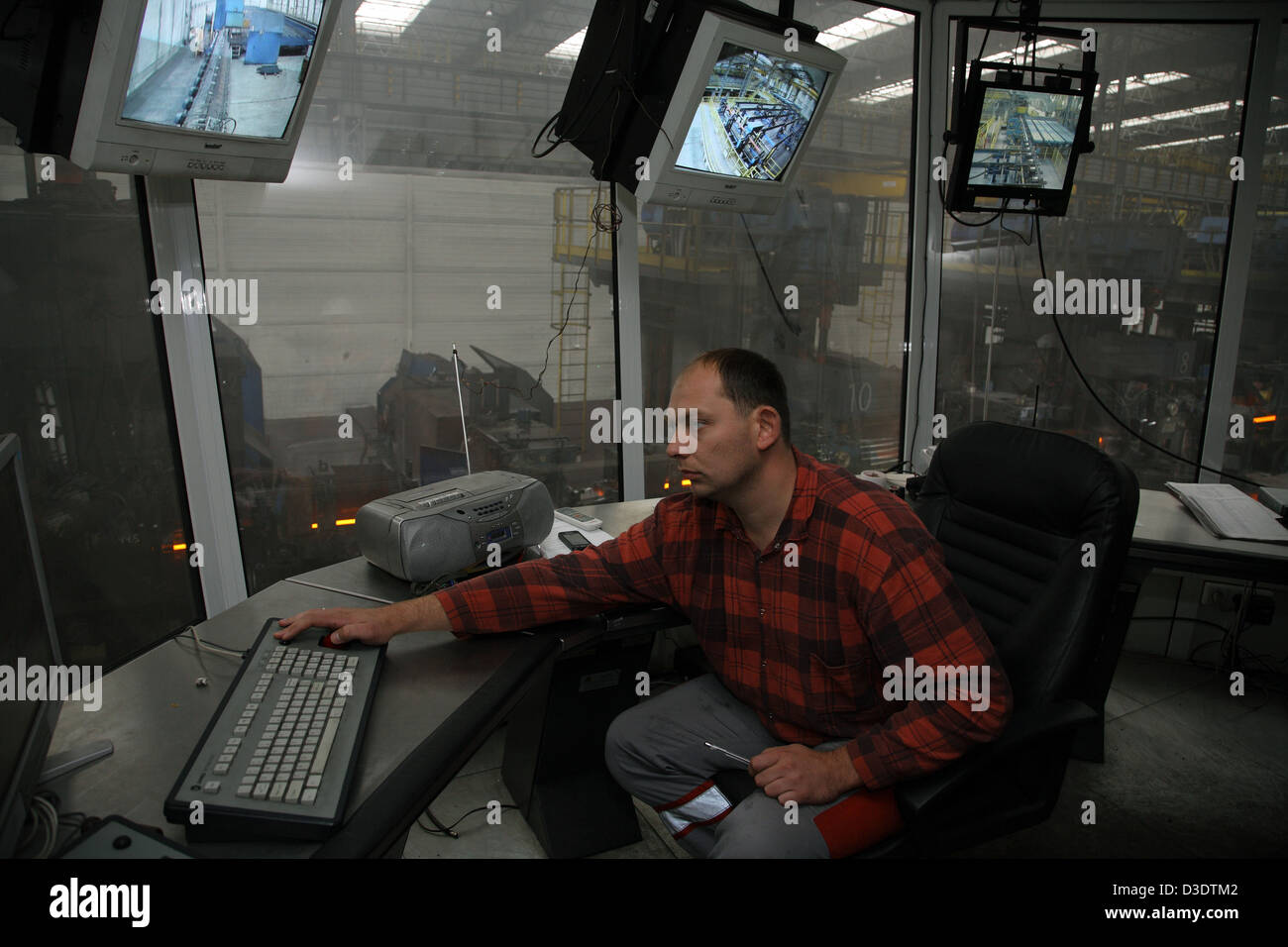 Warsaw, Poland, working in the control room in the steel mill ...