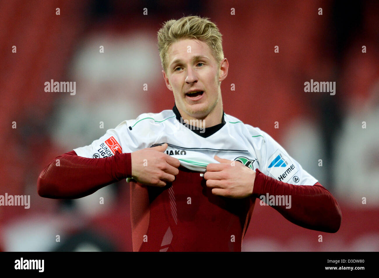 Nuremberg's Sebastian Polter puts on a Hanover shirt after the German ...