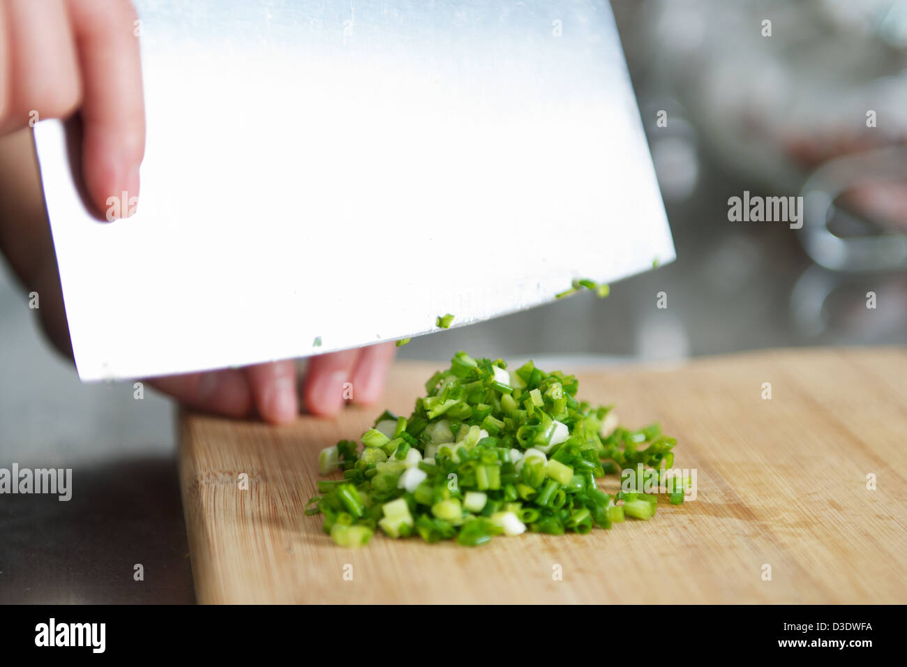 Cutting scallion and preparing the food Stock Photo - Alamy
