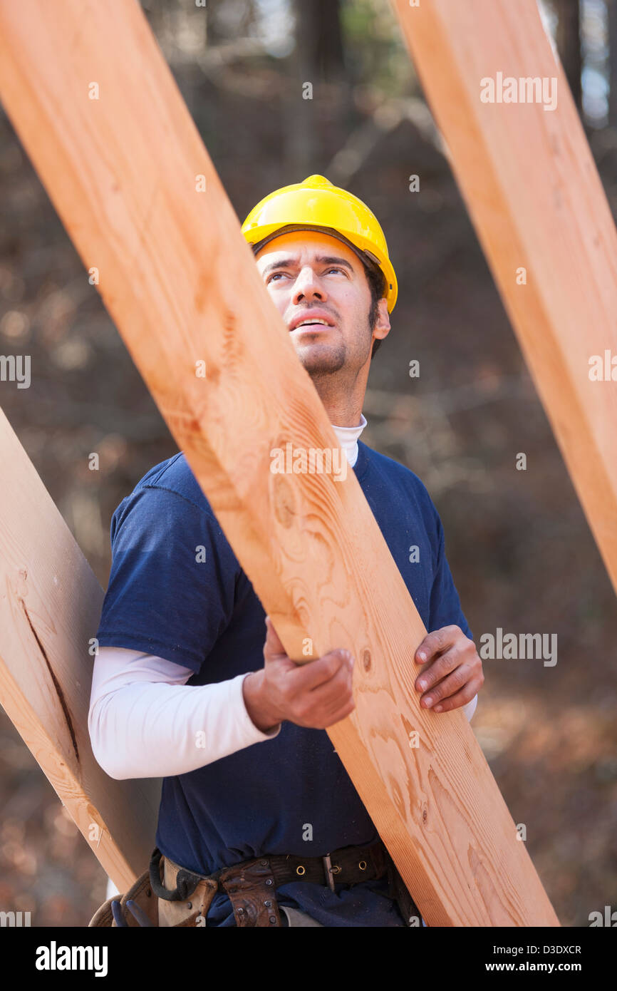 Carpenter placing a rafter Stock Photo - Alamy