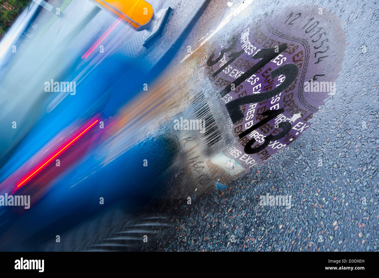 Tax disc on road Stock Photo - Alamy