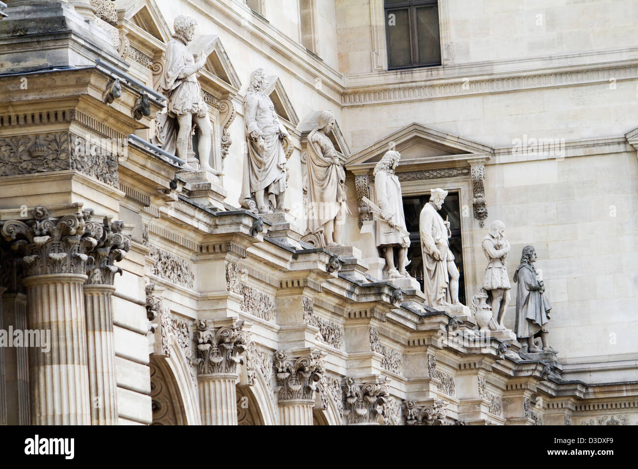 View of the beautiful statues located on the Museum of the Louvre in ...