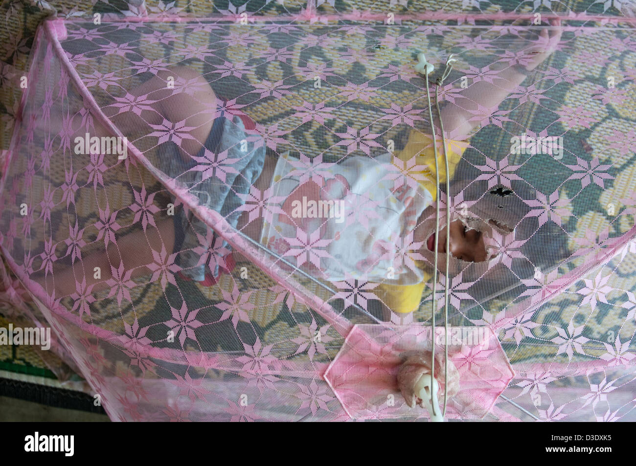 Sleeping under mosquito net hi-res stock photography and images - Alamy