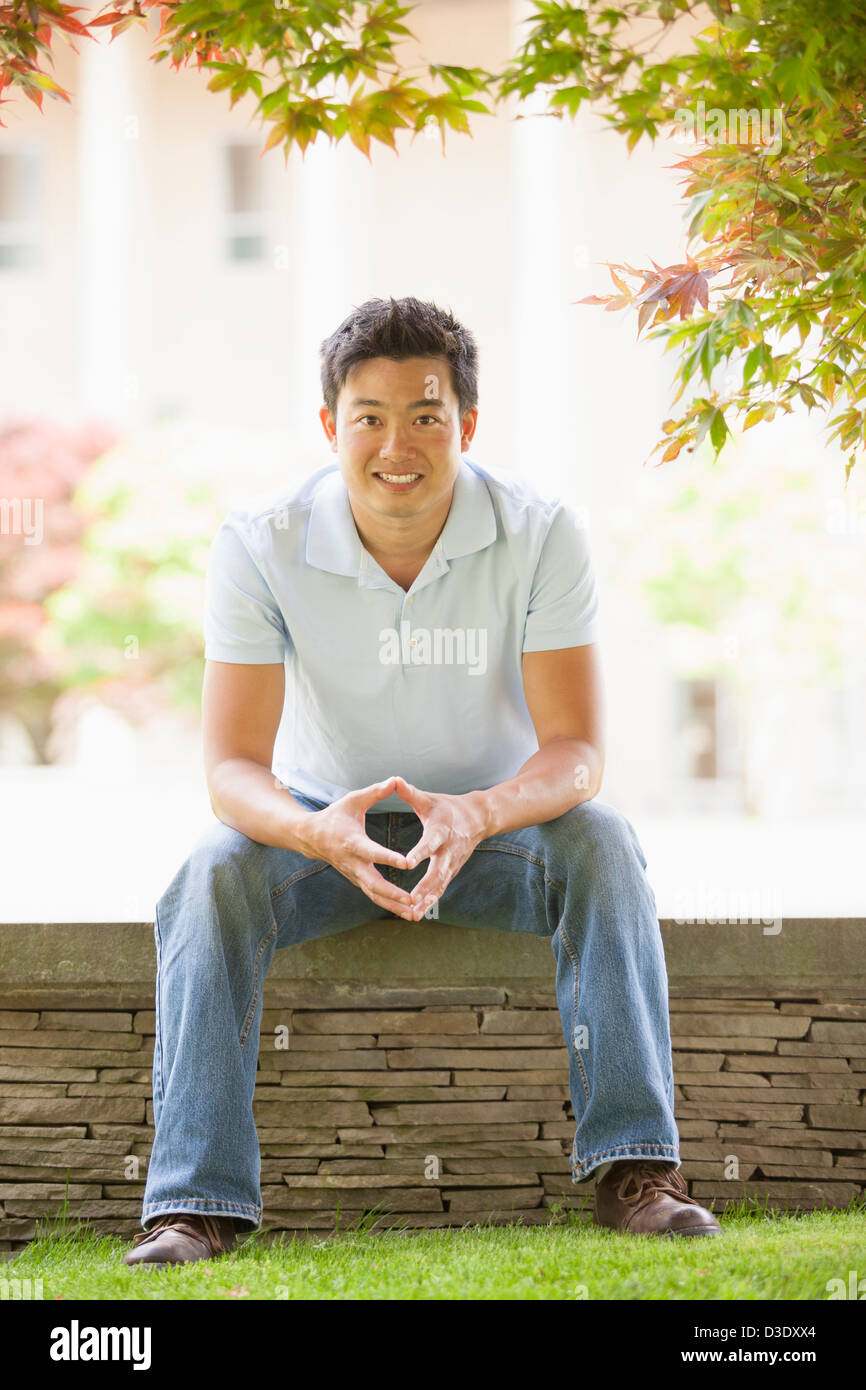 Man is sitting on a stone hi-res stock photography and images - Alamy