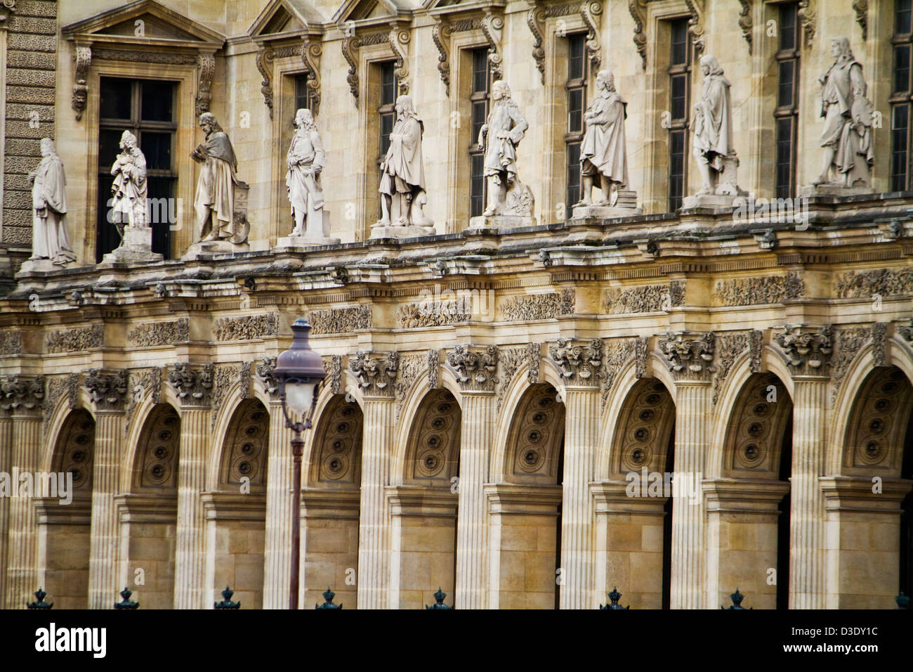 View of the beautiful statues located on the Museum of the Louvre in ...