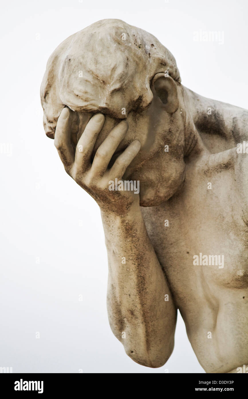Close view of a sad male statue over a white background Stock Photo - Alamy