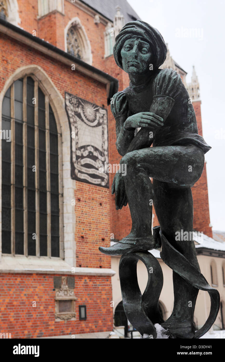 Statue of a medieval man by St Mary's Basilica in Kraków, Poland Stock ...