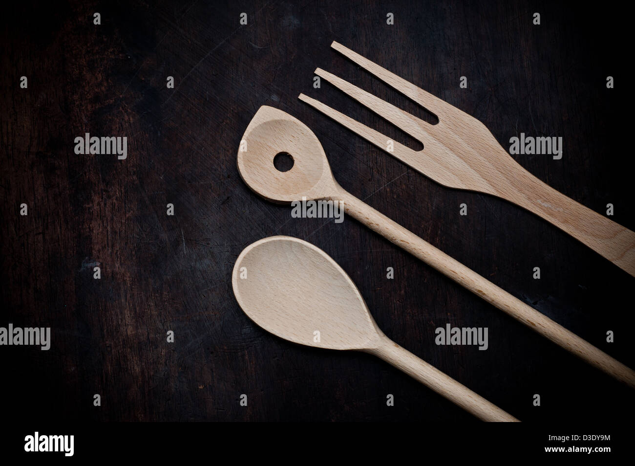 Wooden kitchen spoon on desk Stock Photo - Alamy