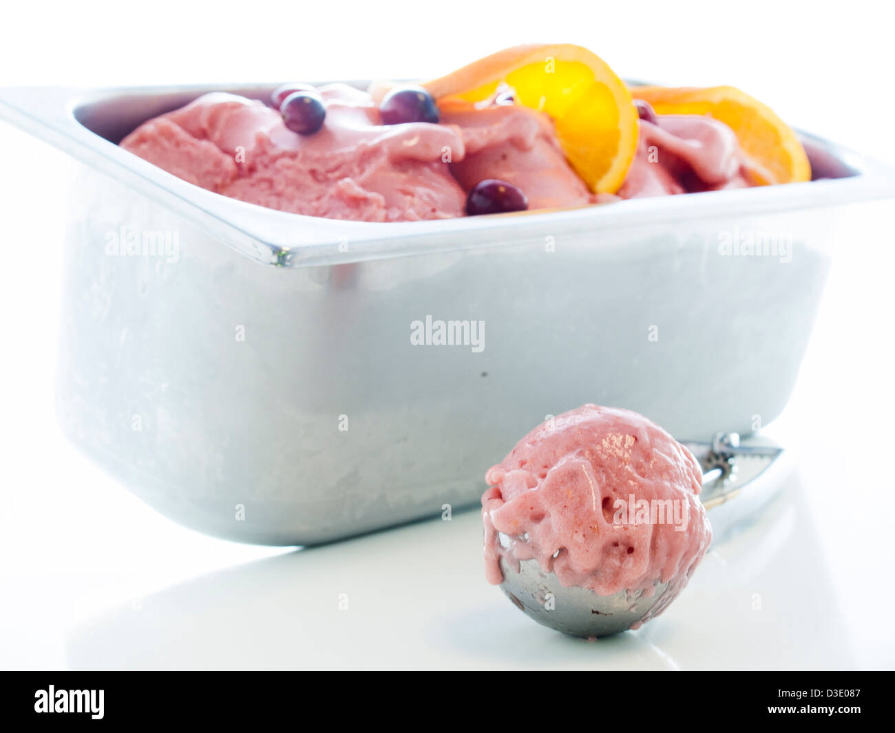 Gourmet sweet orange and cranberry gelato on white background Stock ...