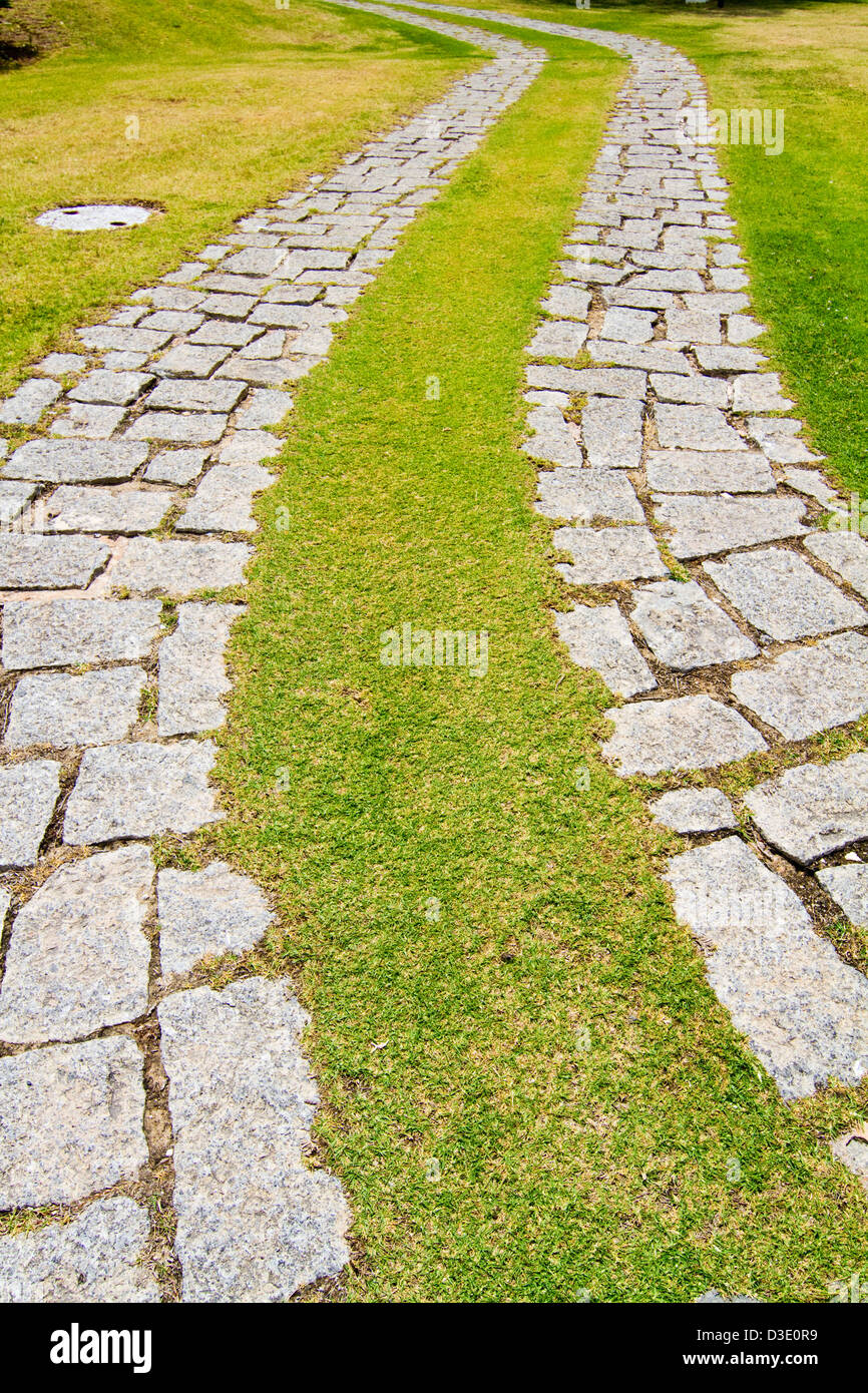 View of a curved cobblestone road on a urban park Stock Photo - Alamy