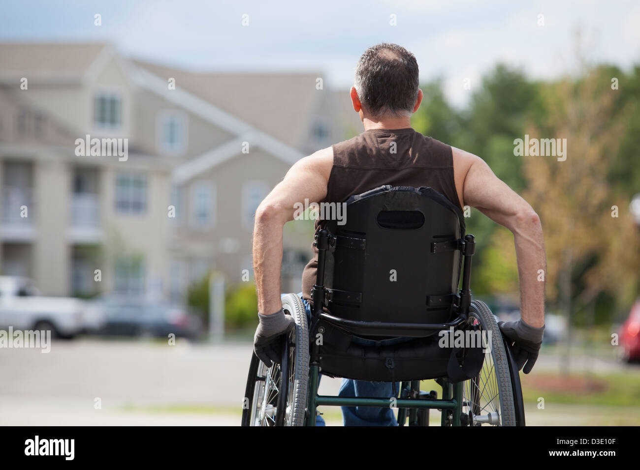Man with spinal cord injury sitting in a wheelchair Stock Photo - Alamy