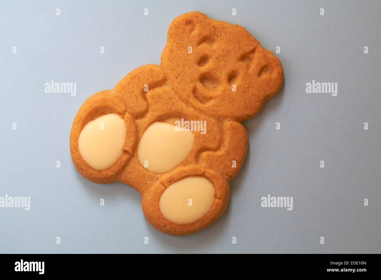 Teddy bear biscuit isolated on pale blue background Stock Photo - Alamy