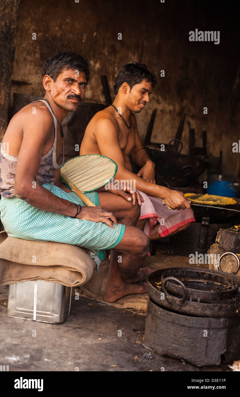 Indian men sitting inside a shop, Varanasi, India Stock Photo - Alamy