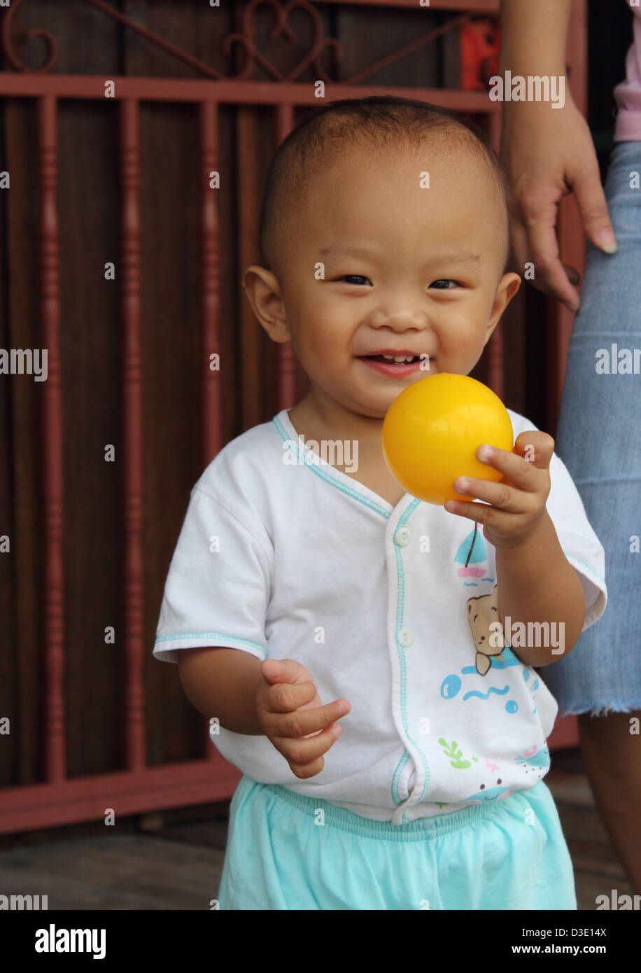 Baby with ball Stock Photo - Alamy