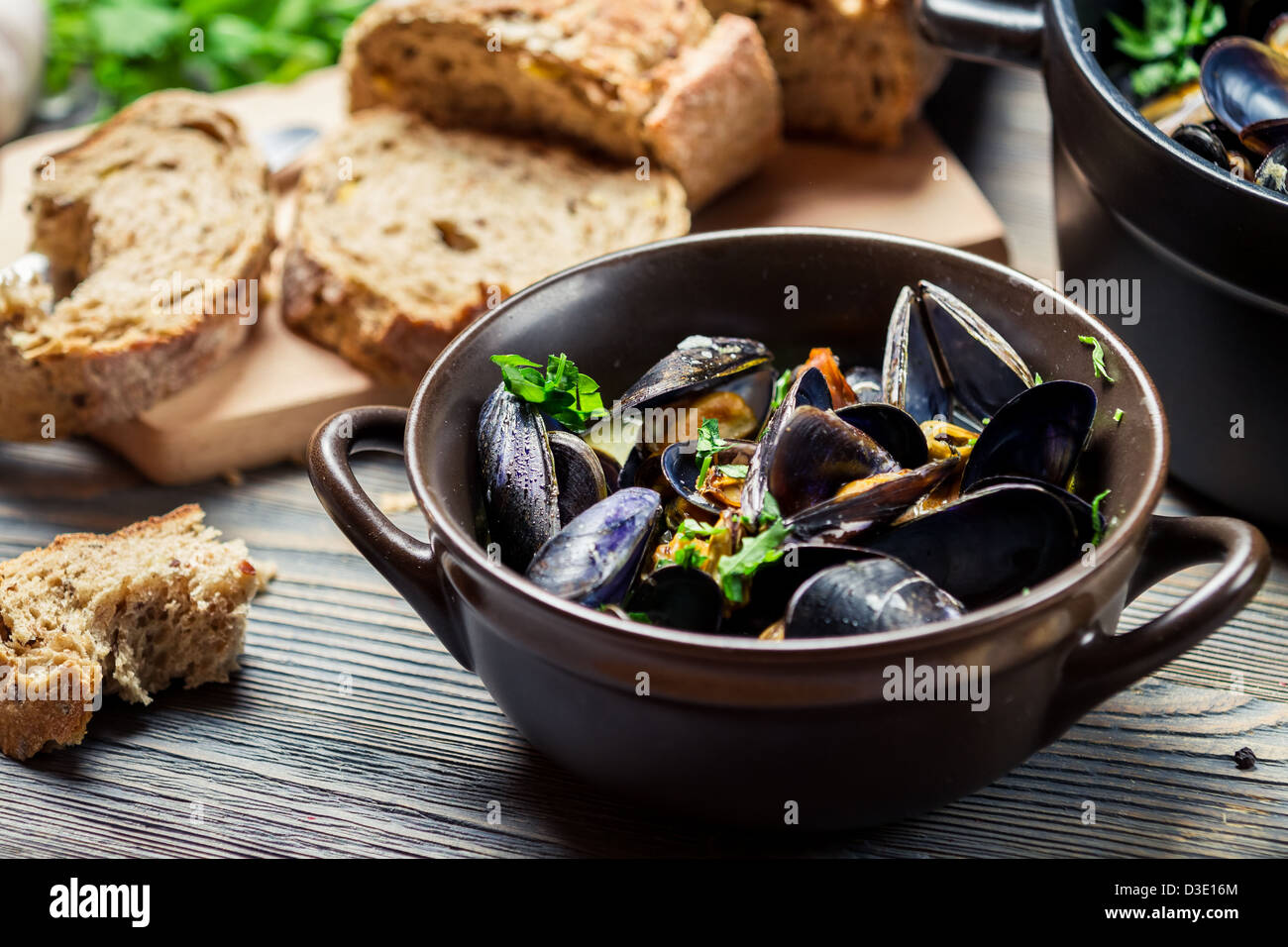 Mussels prepared at home with bread Stock Photo - Alamy