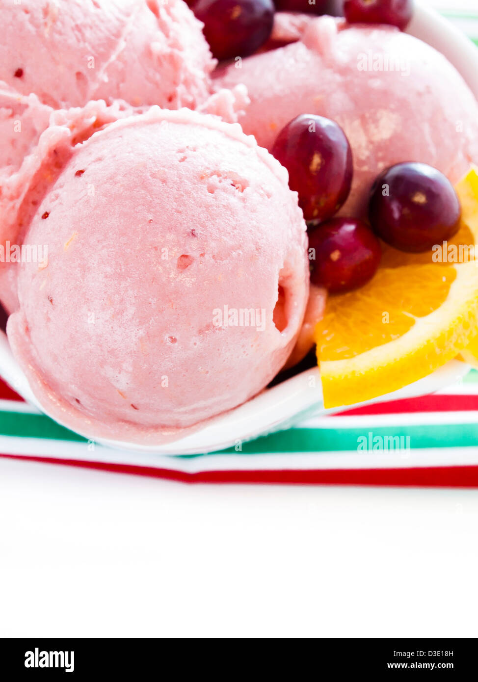 Gourmet sweet orange and cranberry gelato on white background Stock ...
