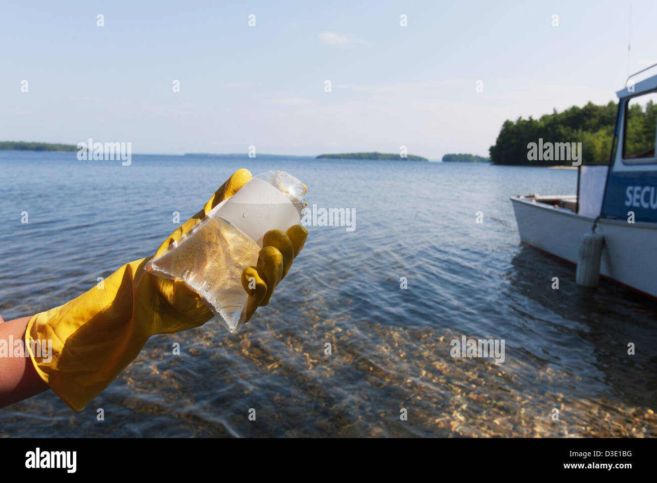 Public works engineer holding water sample taken from reservoir Stock ...