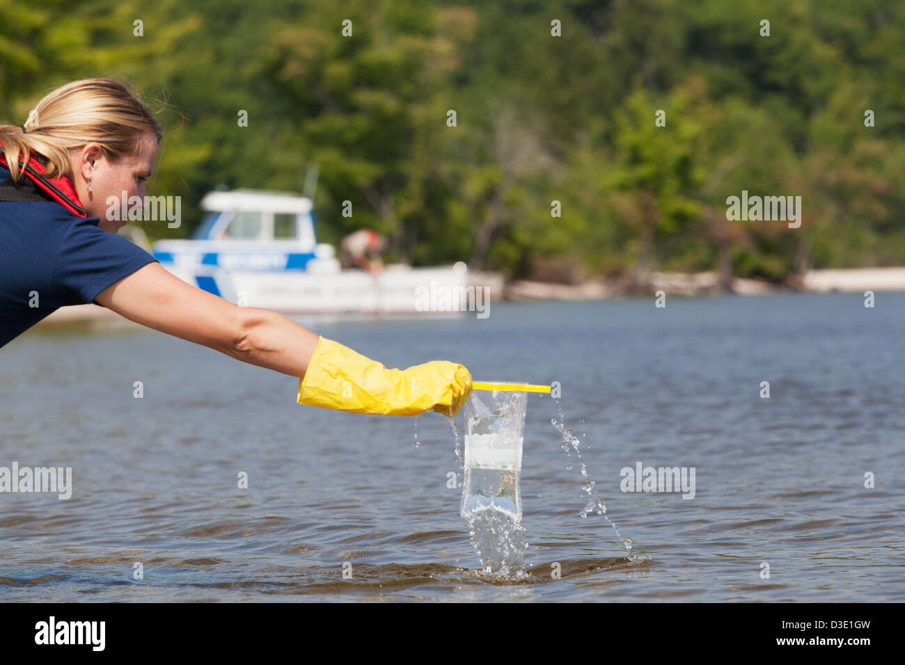 Public works engineer taking public water samples from reservoir Stock ...