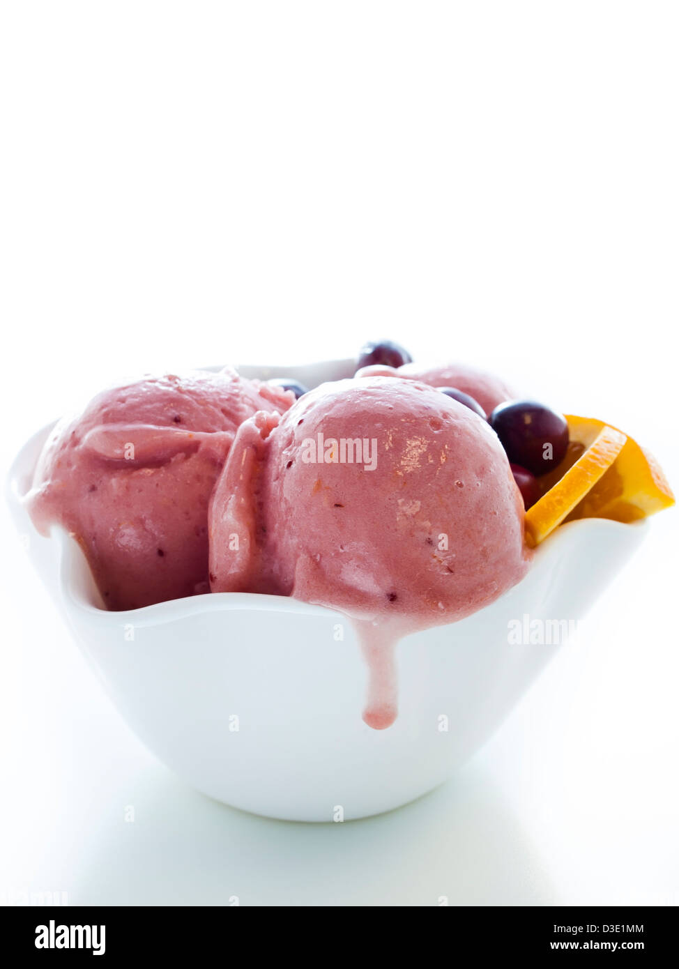 Gourmet sweet orange and cranberry gelato on white background Stock ...