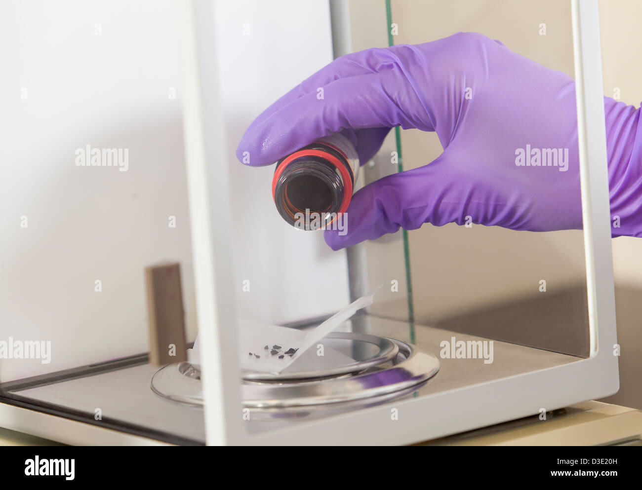Laboratory scientist measuring a precision amount of indigo on ...