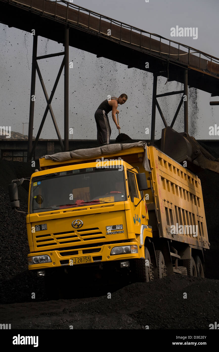 DATONG, SHANXI PROVINCE, CHINA - AUGUST 2007: A coal truck driver ...