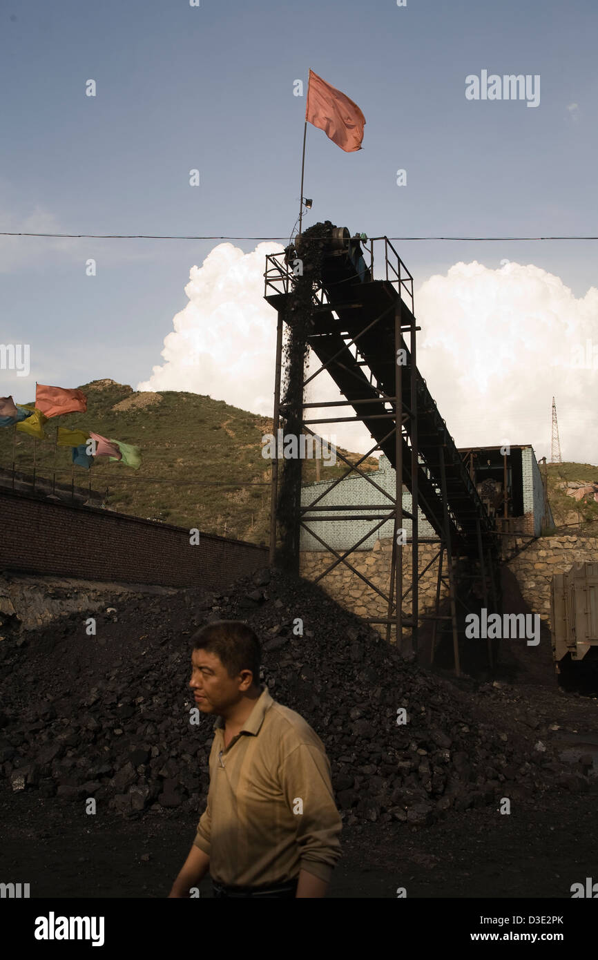 DATONG, SHANXI PROVINCE, CHINA - AUGUST 2007: Coal emerges from ...