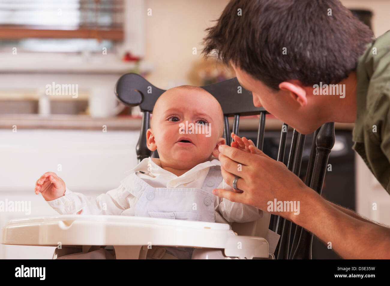 Father consoling his baby son starting to cry Stock Photo - Alamy