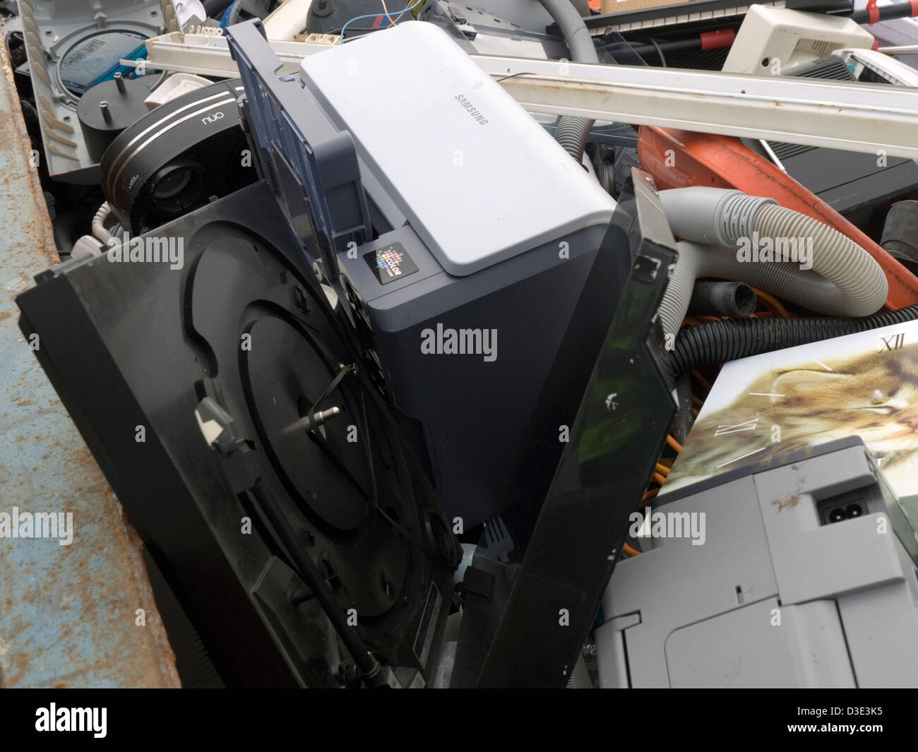 electronic goods in a commercial skip at a recycling center Stock Photo ...