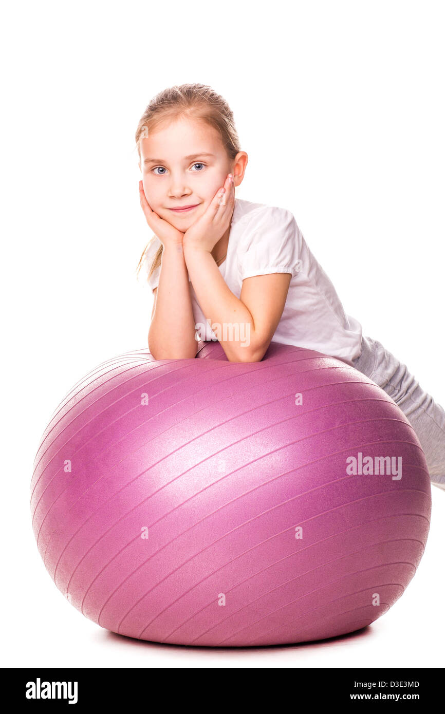 Sportive girl on a fit ball jumping isolated on white Stock Photo - Alamy