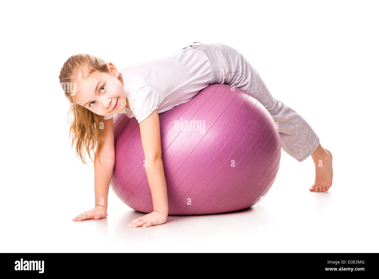 Sportive girl on a fit ball jumping isolated on white Stock Photo - Alamy