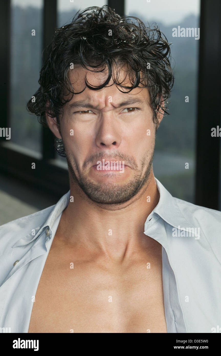 Young Man With Odd Facial Expression Stock Photo - Alamy