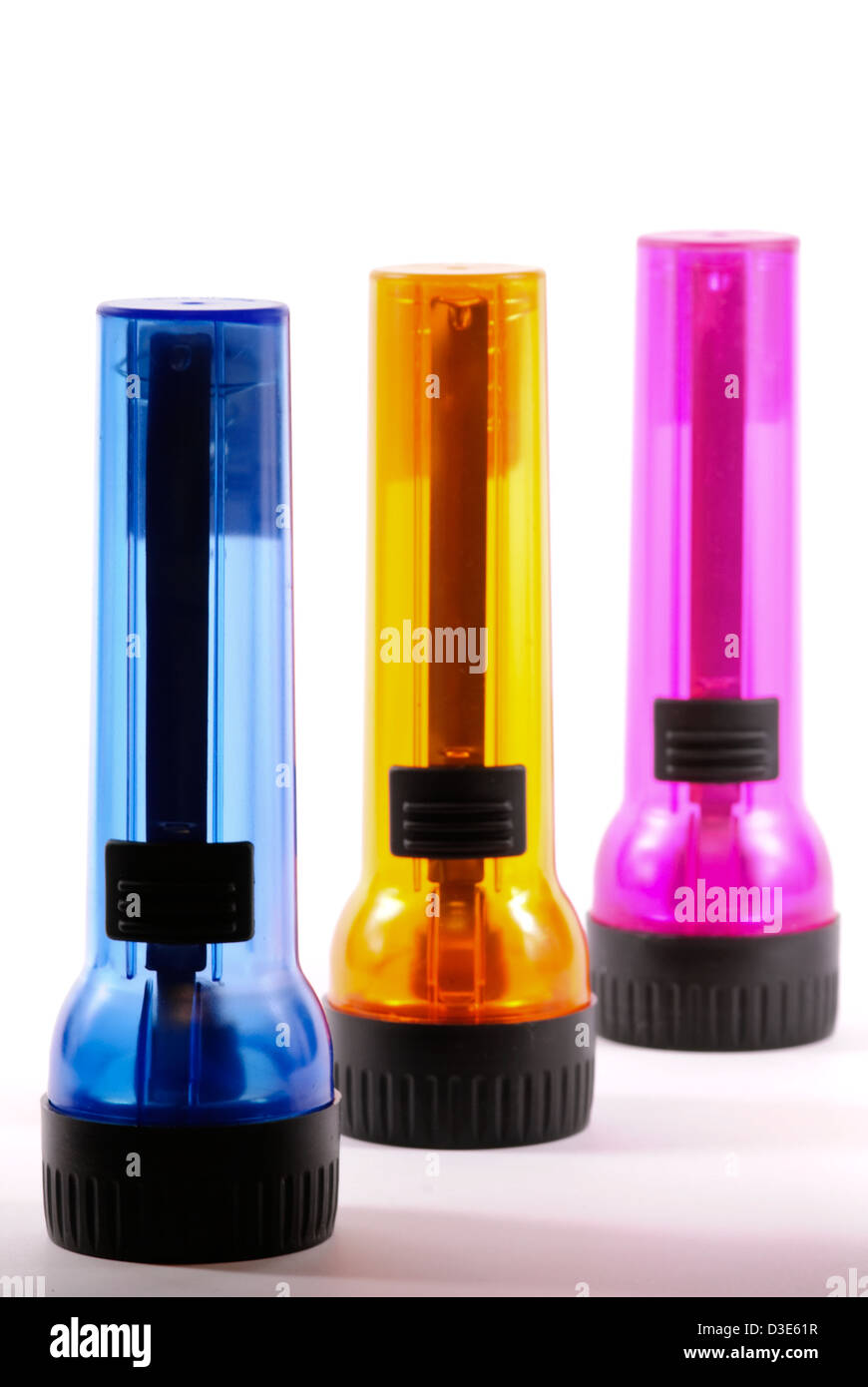Three colorful flashlights on white Stock Photo - Alamy