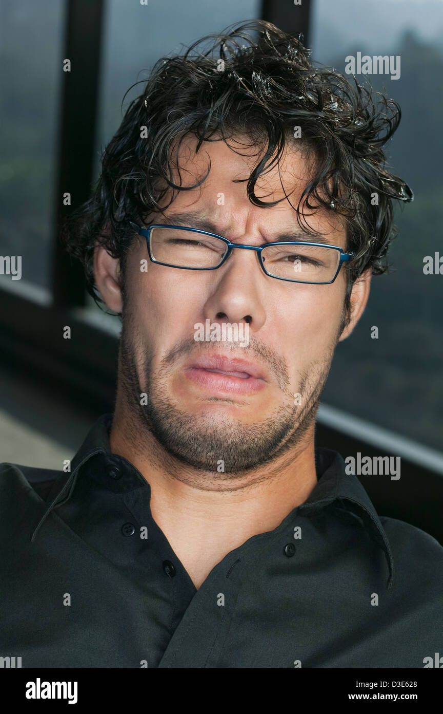 Young Man With Odd Facial Expression Stock Photo - Alamy