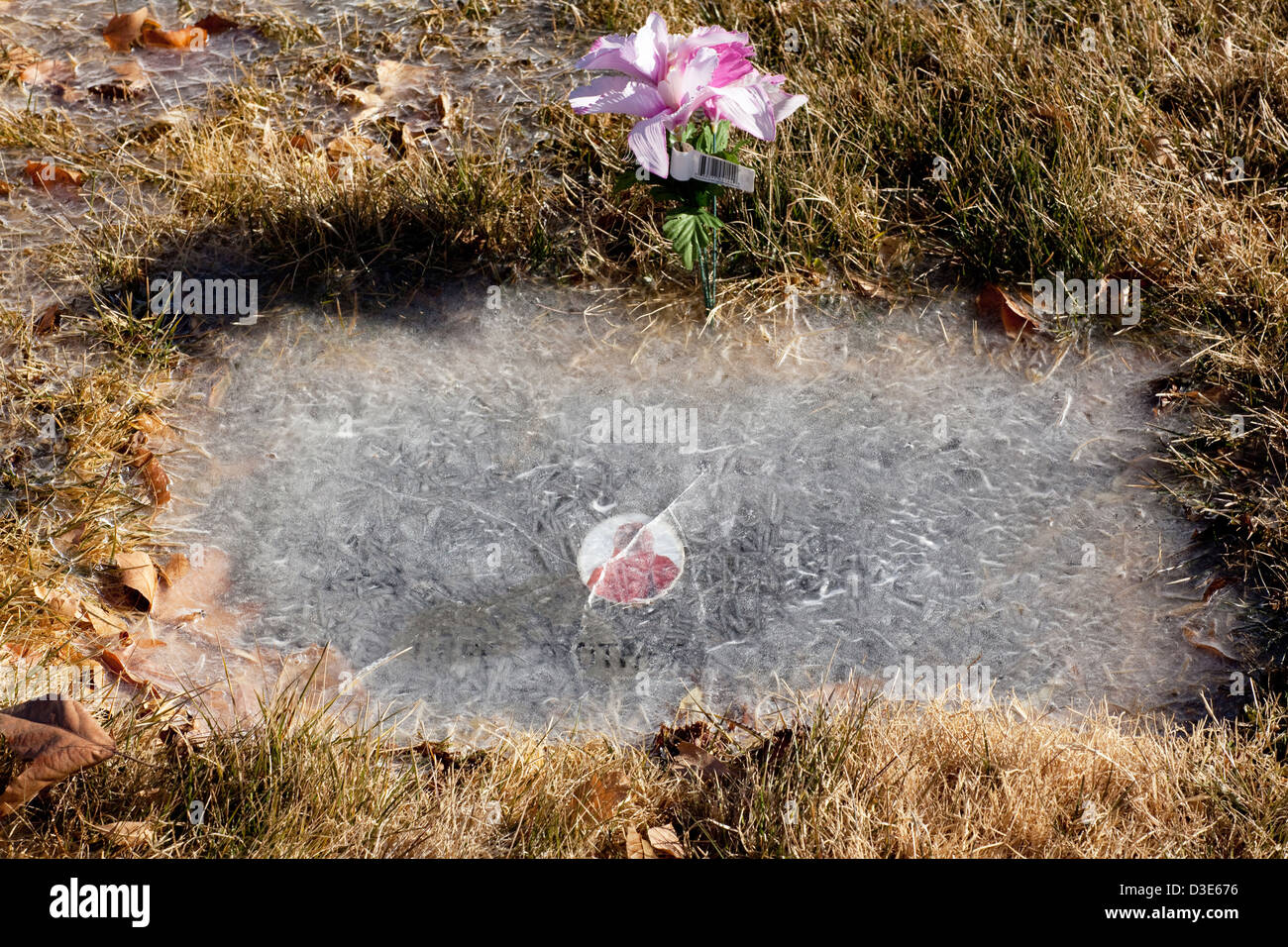 Grave stone covered in ice Stock Photo - Alamy
